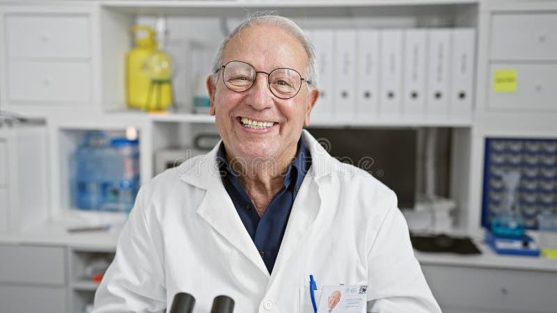 Mature Man Radiating Confidence, a Smiling Senior Scientist Enjoys Work ...