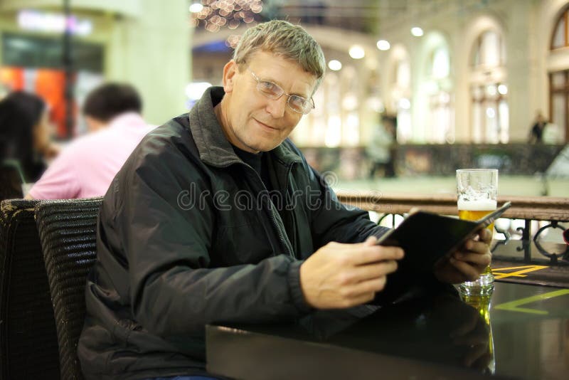 Mature Man Reading Menu Card Stock Photo - Image of cafe, room: 21577486