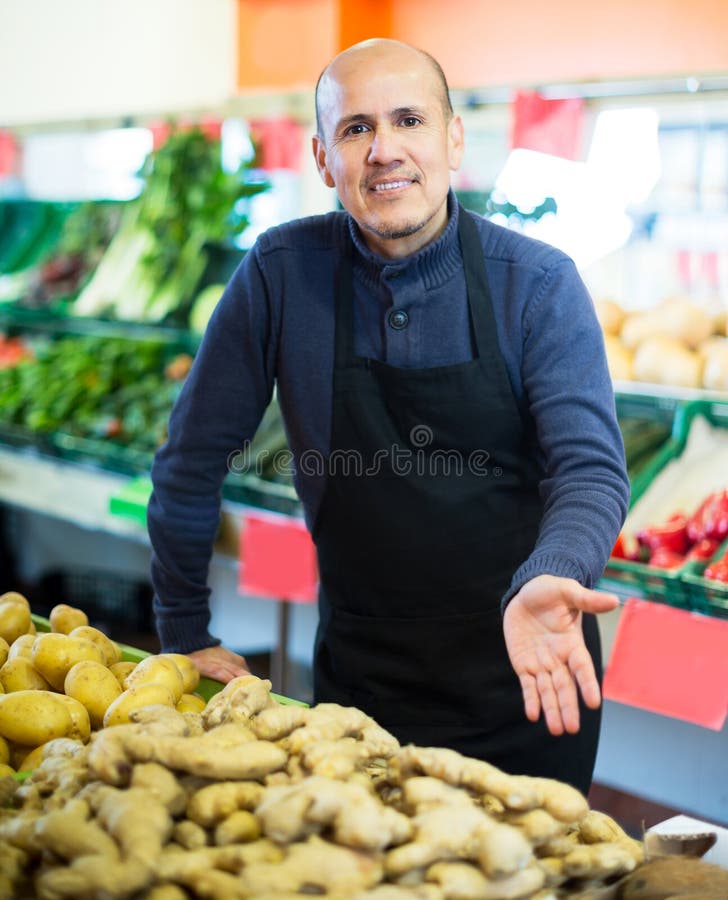 Mature man selling ginger stock photo. Image of happy - 88584560