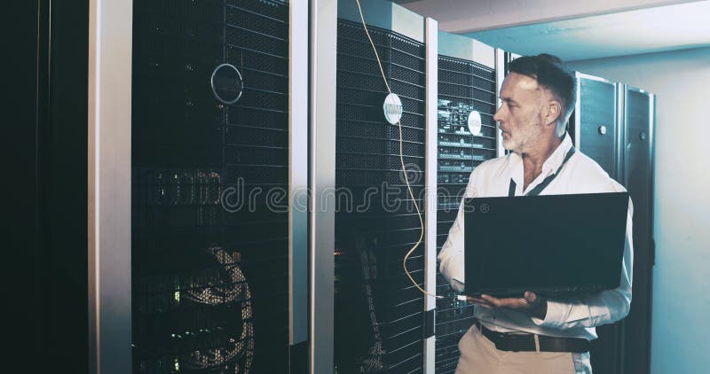 Mature Man in Server Room with Laptop, Inspection on Network and ...