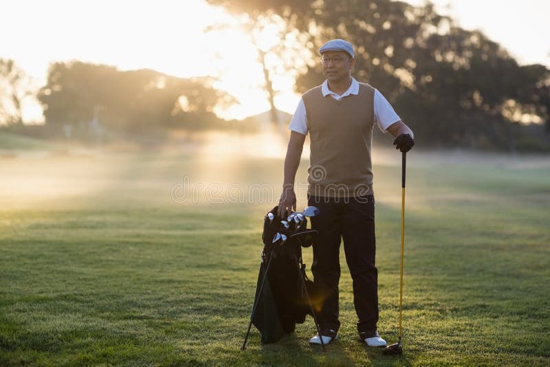 Mature Man Standing at Golf Course Stock Image - Image of bright, front ...