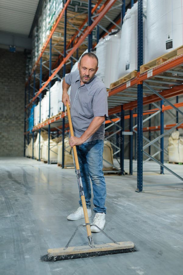 Mature Man Sweeping Warehouse Floor Stock Image - Image of commerce ...