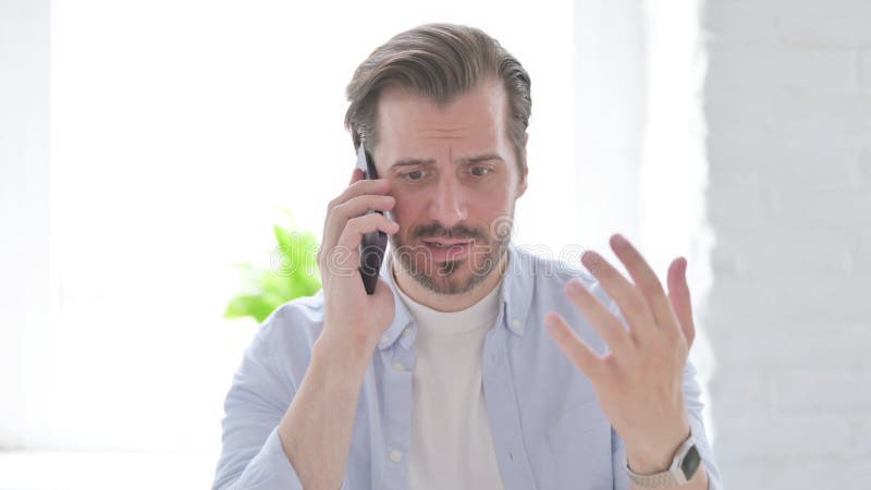 Young Man Talking Angrily on Smartphone Stock Image - Image of shouting ...