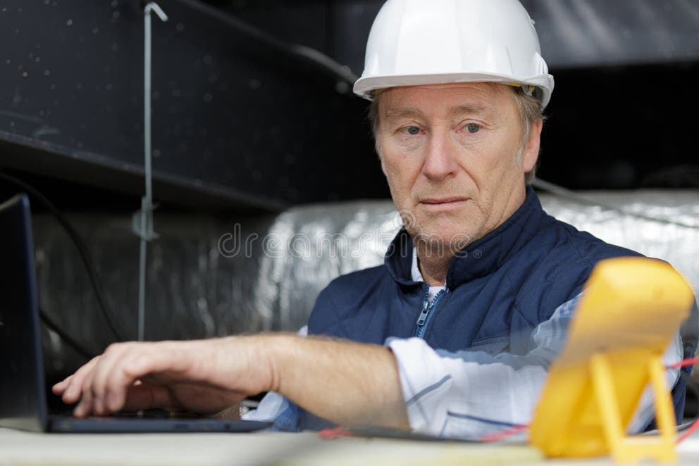 Mature Man Testing Socket with Multimeter Stock Image - Image of outlet ...