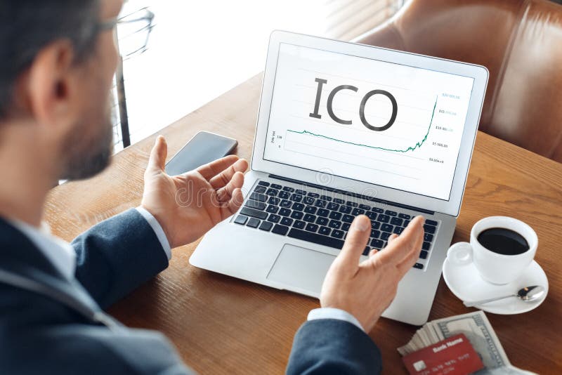 Business Lifestyle. Trader Sitting at Cafe with Coffee and Laptop Using ...