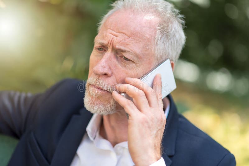 Mature Man Using His Mobile Phone, Light Effect Stock Photo - Image of ...