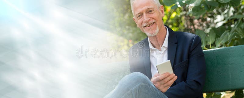 Mature Man Using His Mobile Phone, Light Effect Stock Image - Image of ...