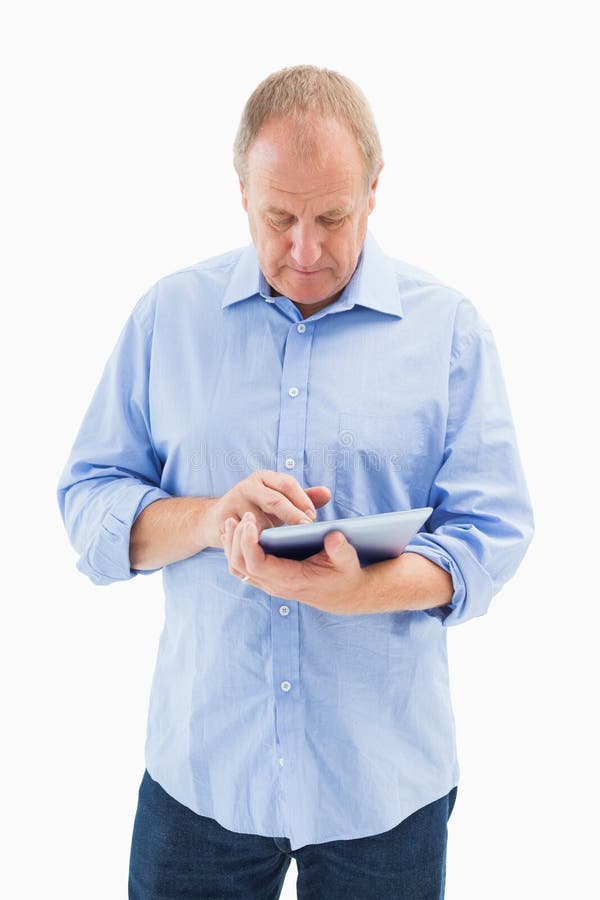 Elderly man using tablet stock image. Image of senior - 23959591