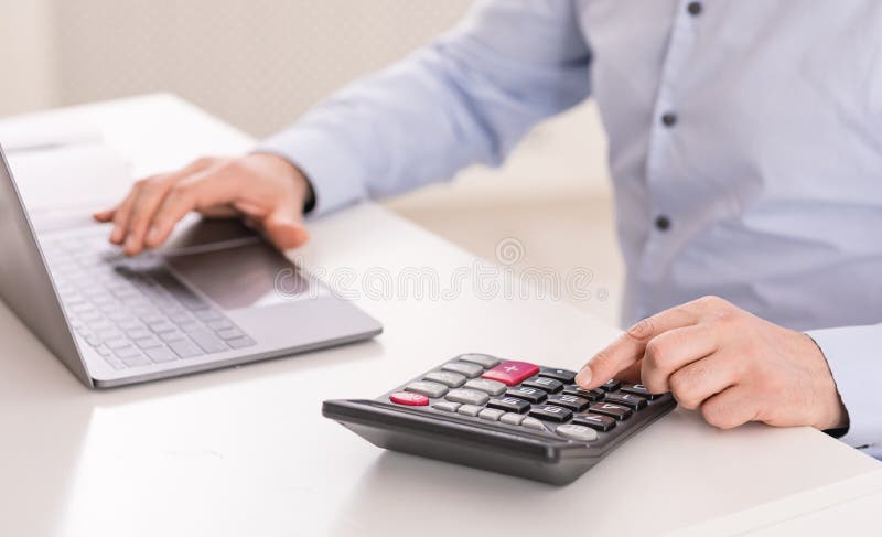 Mature Man Using Laptop and Calculator at Office Stock Image - Image of ...
