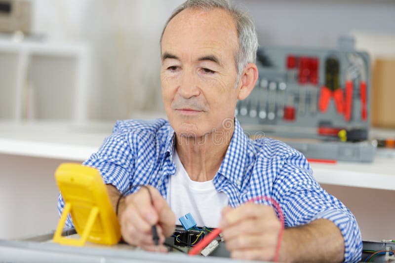 Mature Man Using Multimeter Stock Photo - Image of person, probe: 281060342