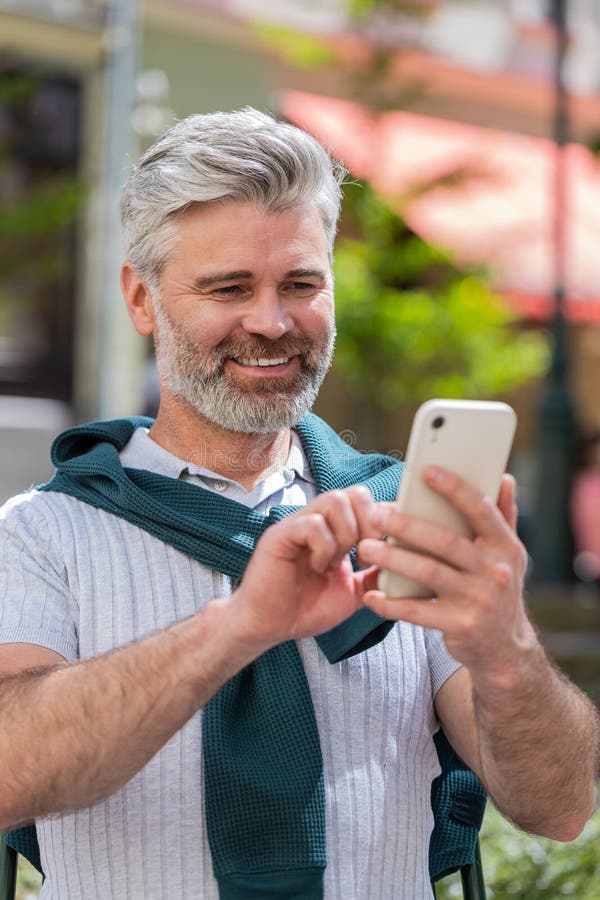 Mature Man Using Smartphone Typing Text Messages Internet Social Media ...