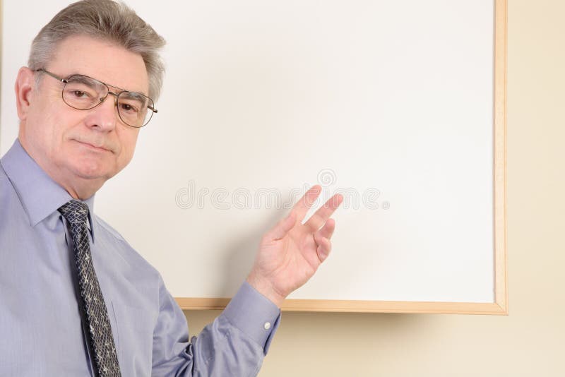 Mature man at whiteboard stock photo. Image of professor - 4180512