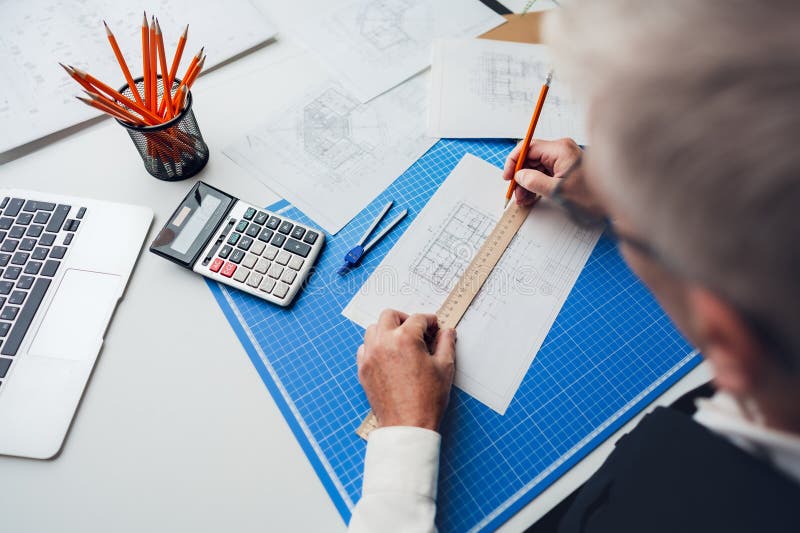 Mature Man Working on Architectural Project in Office Stock Photo ...