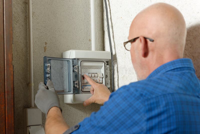Mature Man Working with Electric Box at House Stock Photo - Image of ...