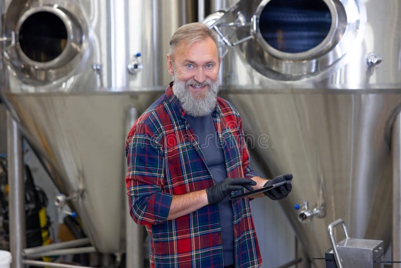 Mature Man Working at the Factory and Looking Contented Stock Image ...