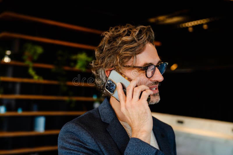 Mature Manager Talking on Mobile Phone during Offline Meeting Stock ...