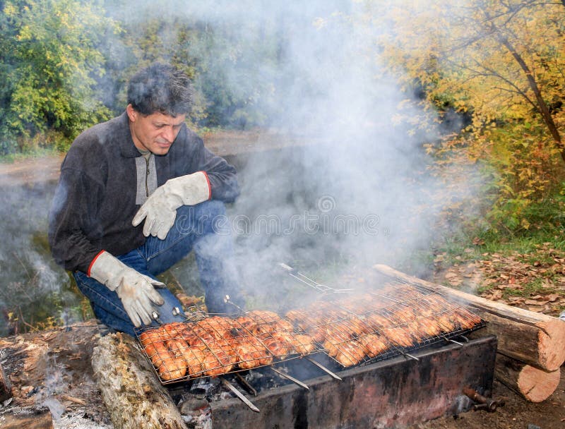 Mature Men Make Barbecue on the Grill in Nature Against the Backdrop ...
