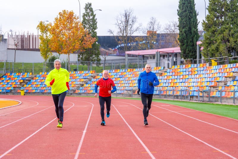 Mature Men Running in an Athletics Track Stock Photo - Image of speed ...