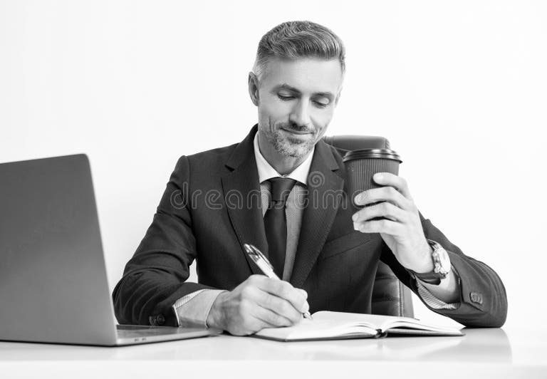 Mature Office Worker Writing at the Table in Business Office and ...