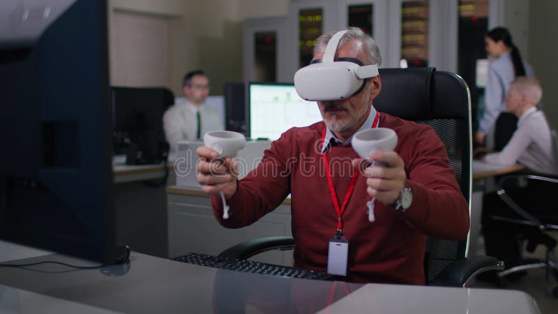 Mature it Programmer Put on Vr Goggles and Take Controllers Working at ...