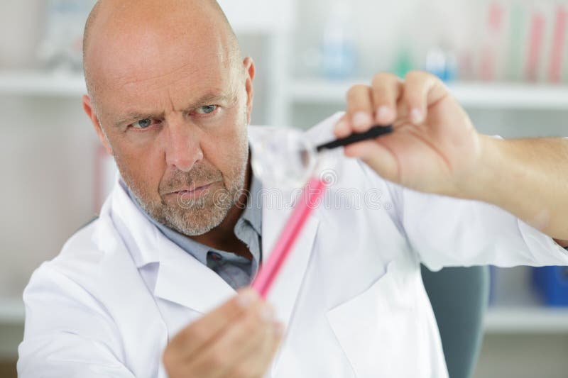 Mature Scientist Holding Flask in Chemical Lab Stock Image - Image of ...