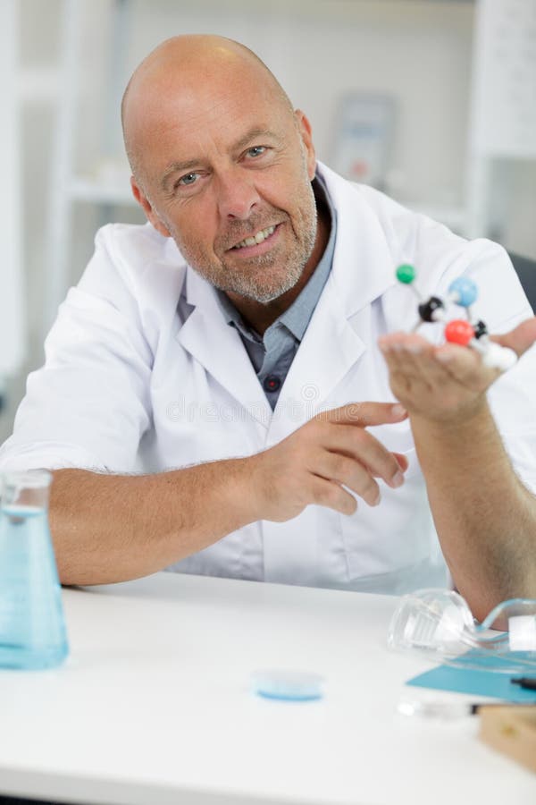 Mature Scientist Making Research Over Dna Molecule Structure Stock ...