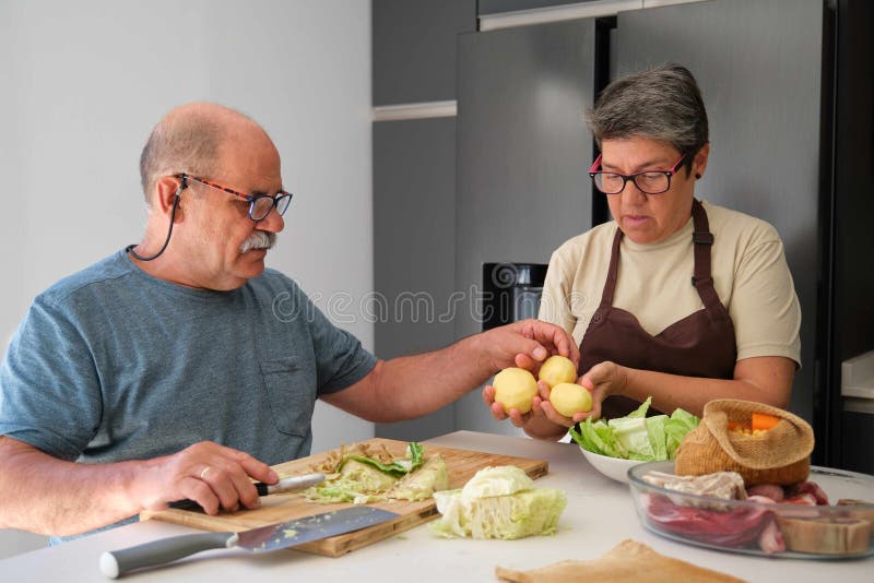 Mature Spanish Couple Cooking Cocido, Typical Spanish Dish. Stock Image ...