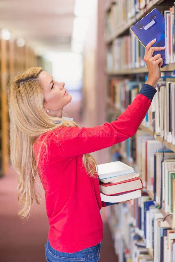 Mature Student Picking Out Book in Library Stock Image - Image of adult ...