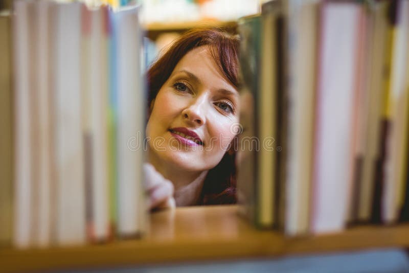 Mature Student Picking Out Book in Library Stock Image - Image of woman ...