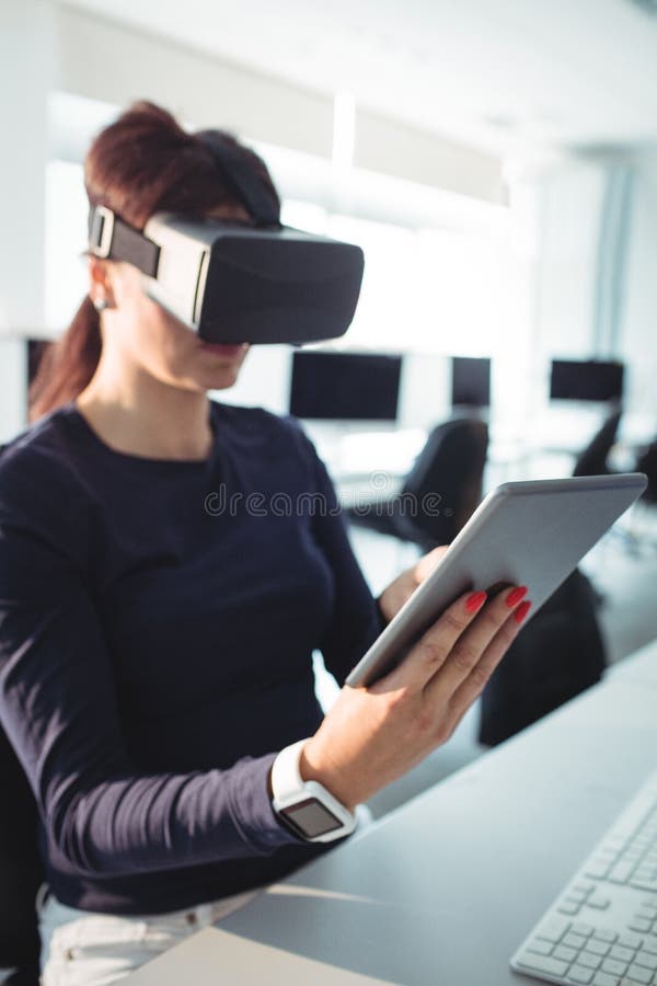 Mature Student in Virtual Reality Headset Using Digital Tablet Stock ...