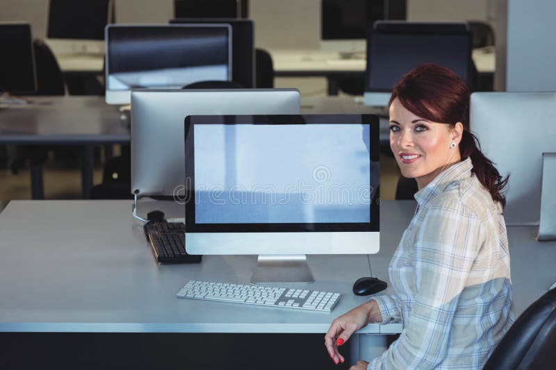 Woman Typing on Desktop Keyboard at Computer Lab Desk with Computer ...
