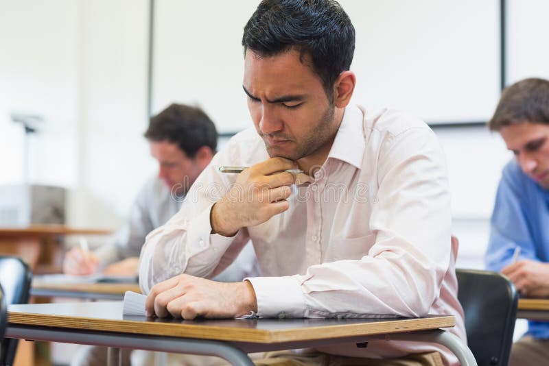 Mature Students Taking Notes in Classroom Stock Photo - Image of ...