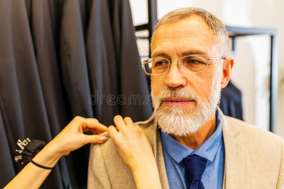 Mature Tailor Working with Sewing Pattern in Atelier Stock Photo ...