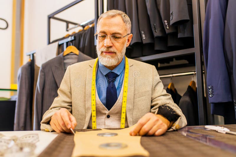 Mature Tailor Working with Sewing Pattern in Atelier Stock Image ...