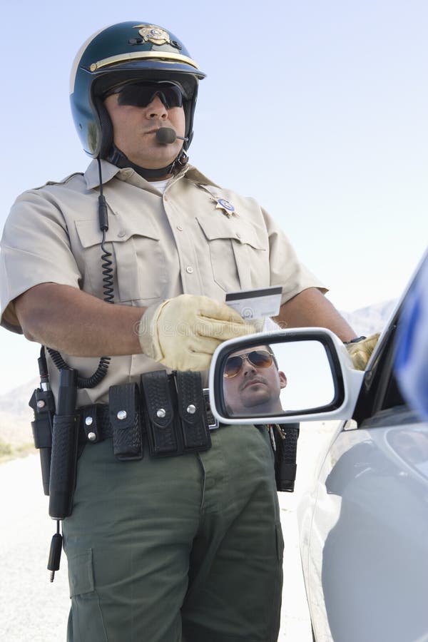 Mature Traffic Cop Holding License Stock Image - Image of person, aged ...
