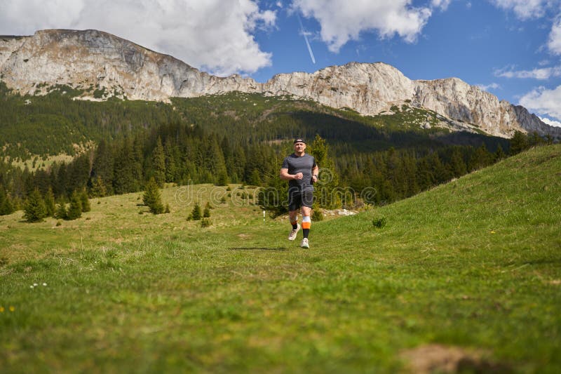 Mature Trail Runner in the Mountains Stock Photo - Image of workout ...