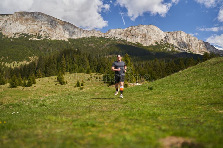 Mature Trail Runner in the Mountains Stock Photo - Image of workout ...