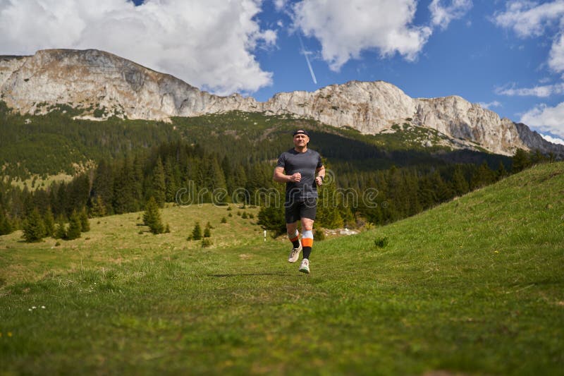 Mature Trail Runner in the Mountains Stock Photo - Image of running ...