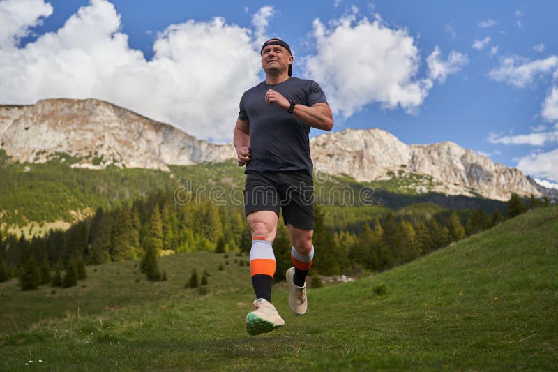 Mature Trail Runner in the Mountains Stock Photo - Image of senior ...
