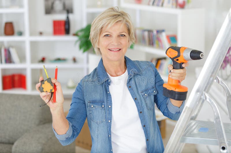 Mature woman doing diy stock photo. Image of paint, woman - 288846266