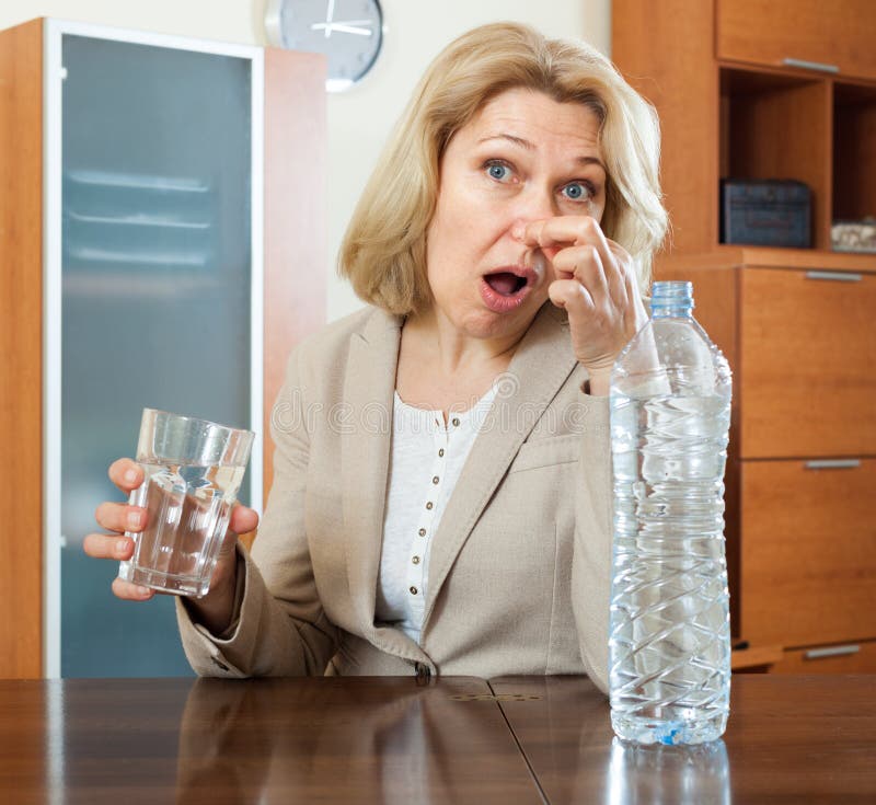 Mature Woman with Grass of Poor Quality Water Stock Photo - Image of ...
