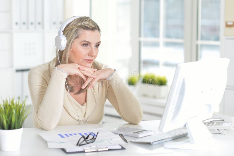 Portrait of Mature Woman Using Computer at Home Stock Image - Image of ...