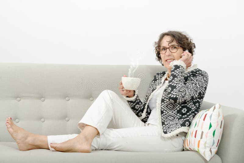 Mature Woman with Phone, Drinking Tea Stock Image - Image of room ...