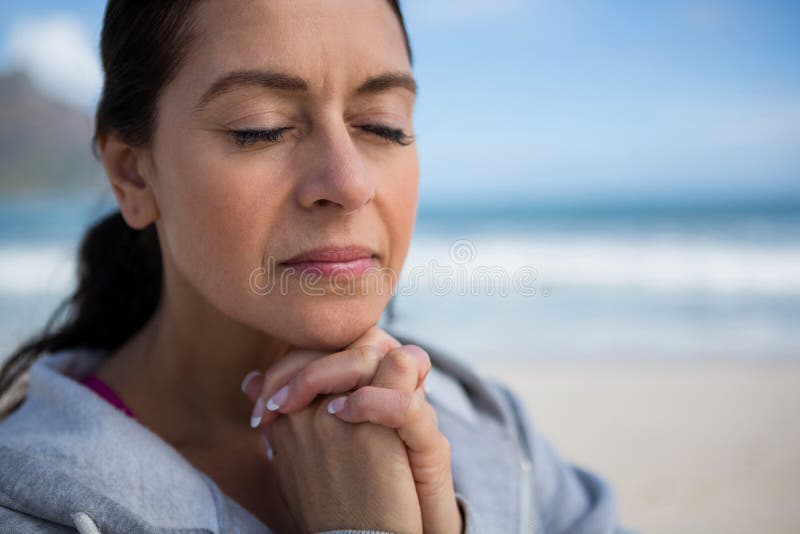 Mature Woman Praying with Hands Clasped Stock Photo - Image of believe ...