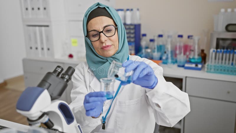 Mature Woman Scientist in Hijab Conducting Research in Laboratory ...
