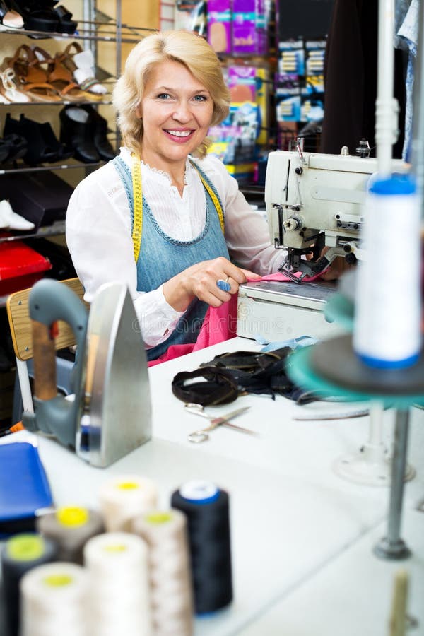 Mature Woman Sewing with Professional Machine Stock Photo - Image of ...