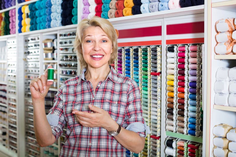 Mature Woman in Sewing Store Stock Image - Image of female, craft: 82650745
