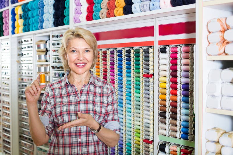 Mature Woman in Sewing Store. Stock Image - Image of thread, price ...