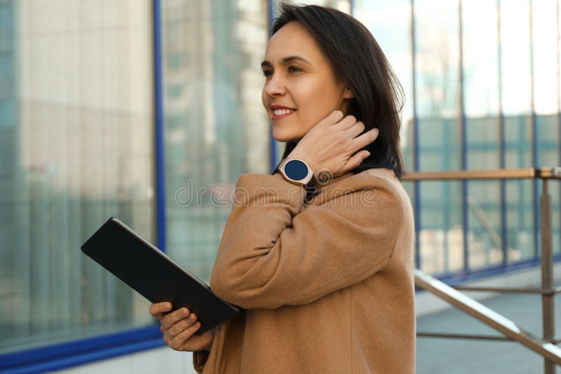 Mature Woman with Tablet and Smart Watch Outdoors Stock Image - Image ...