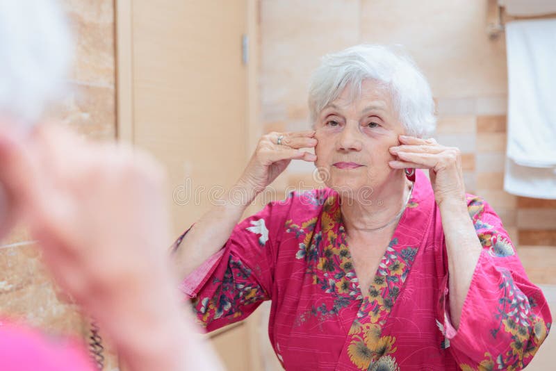 Mature Woman Taking Care Of Her Face Stock Image Image Of Cosmetic